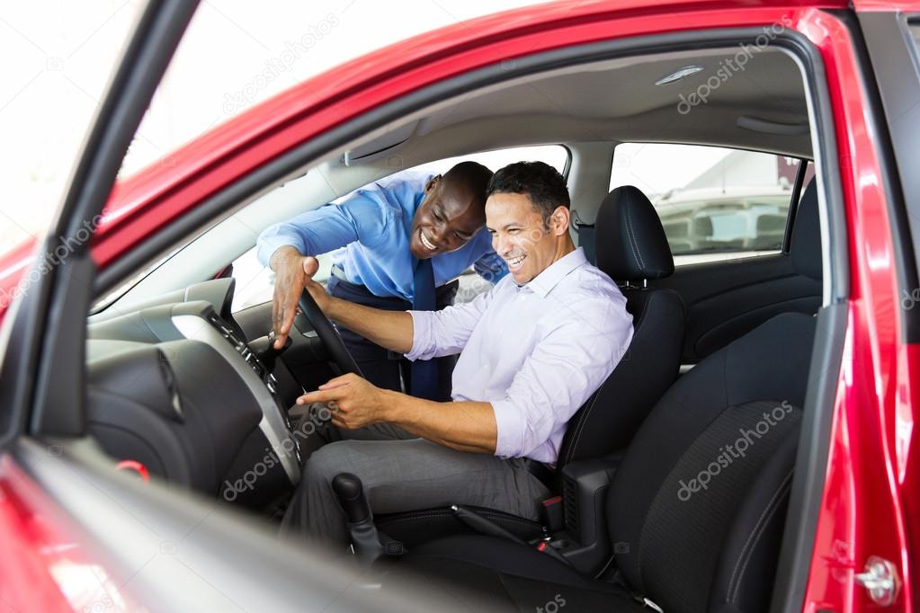 Man checking car features in showroom — Stock Photo © michaeljung #71212307