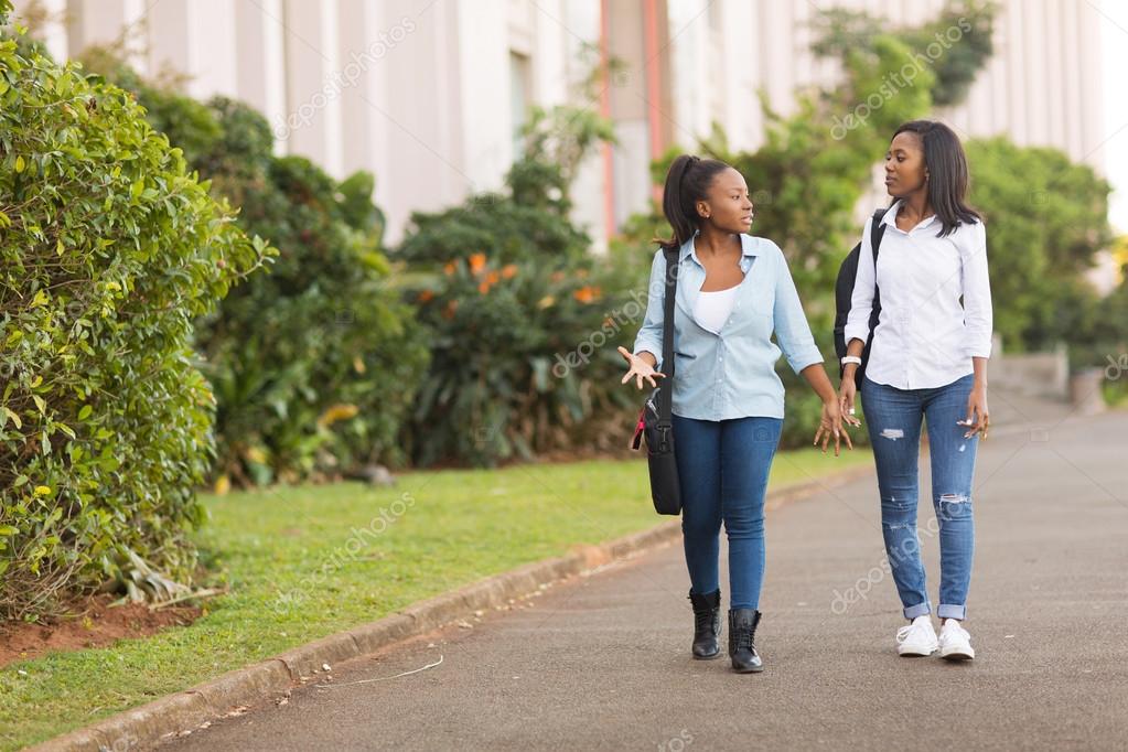 Students walking together on campus — Stock Photo © michaeljung #77097435