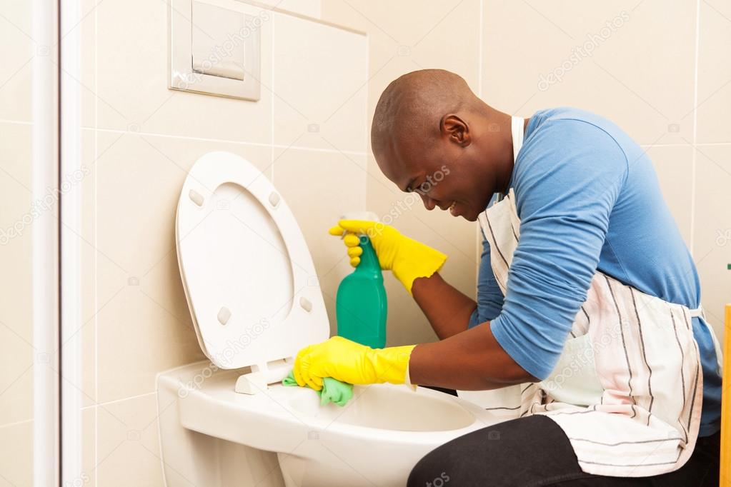 Man Cleaning Bathroom