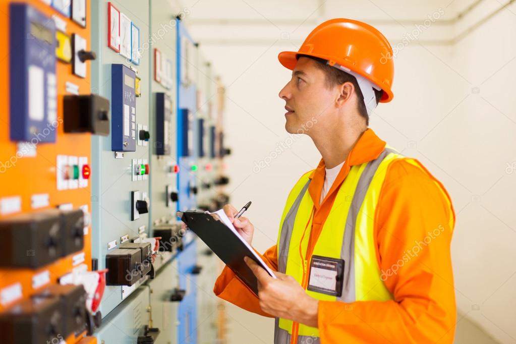Electrical engineer taking machine readings Stock Photo by ©michaeljung ...