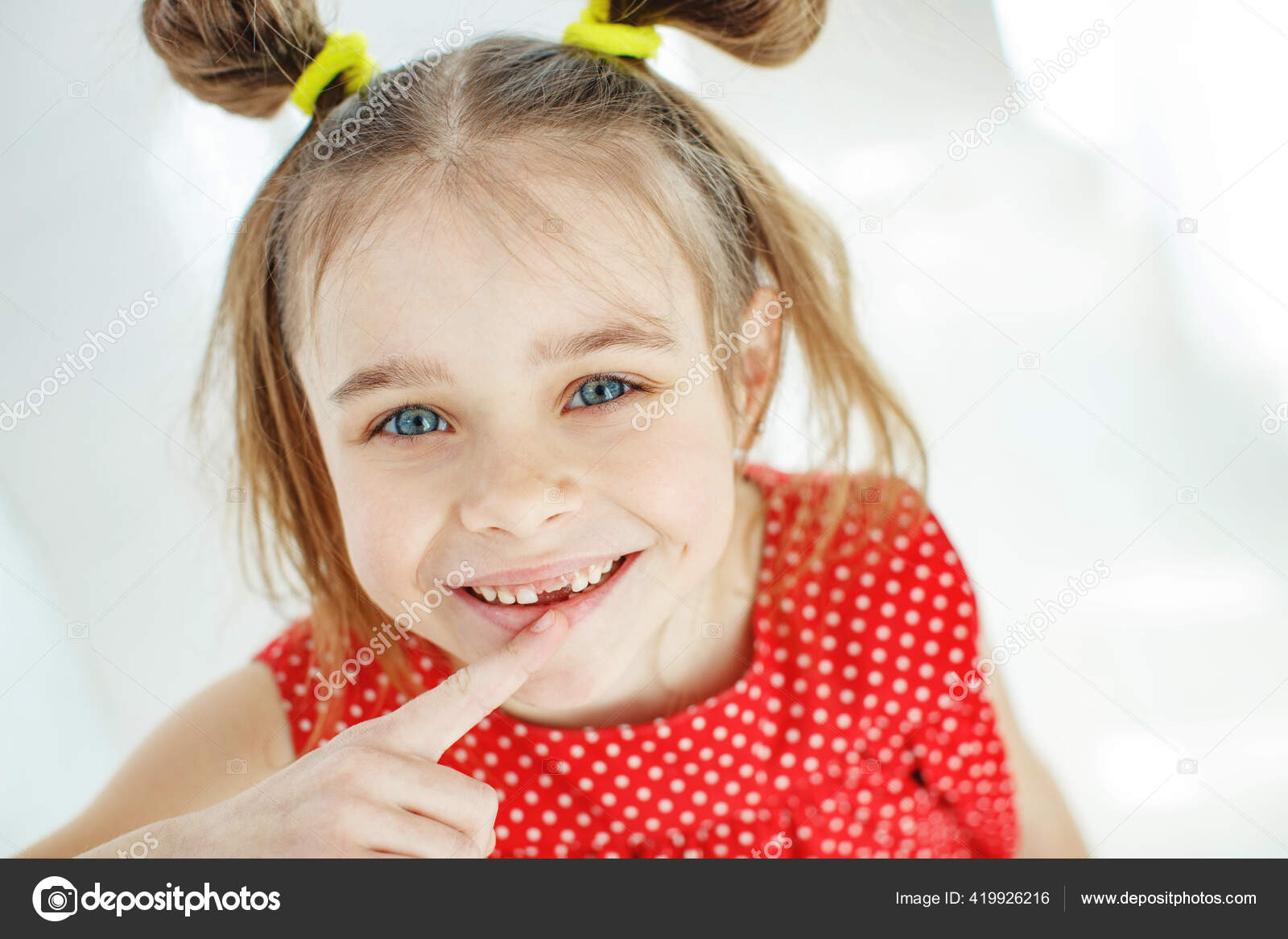 A beautiful little girl lost the first milk tooth. Loss of primary ...