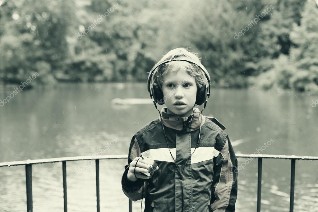 Cute autistic boy with headphones — Stock Photo © Dubova #85825488