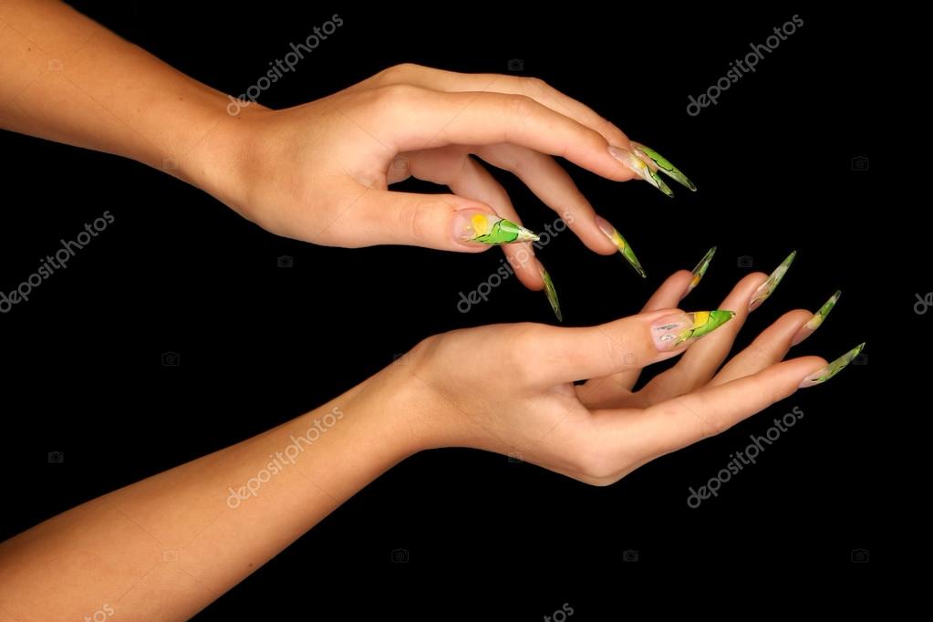 Pretty woman hand with perfect painted nails isolated on black ...