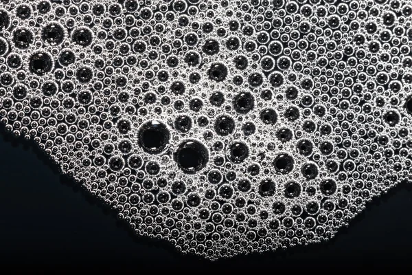 White foam on a black background. - Stock Image - Everypixel