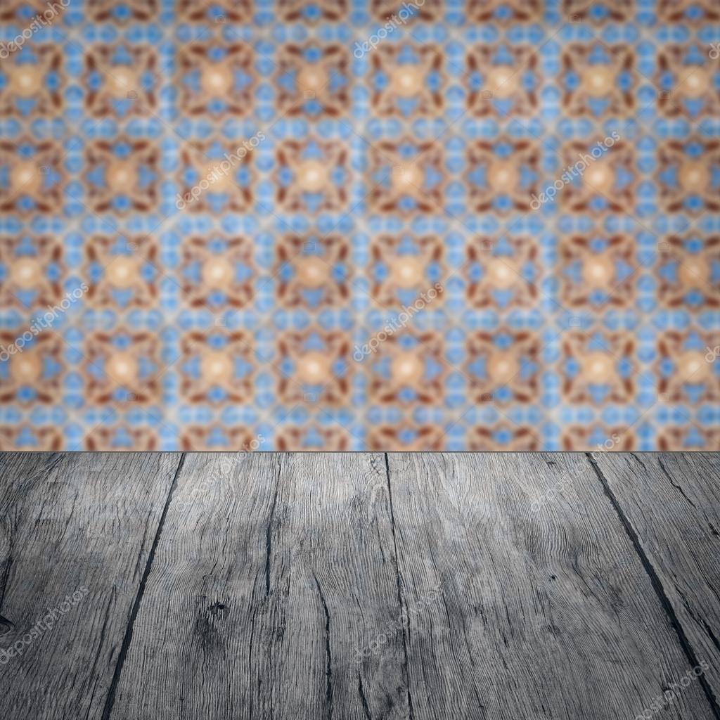 Wood table top and blur ceramic tile wall — Stock Photo © homydesign ...