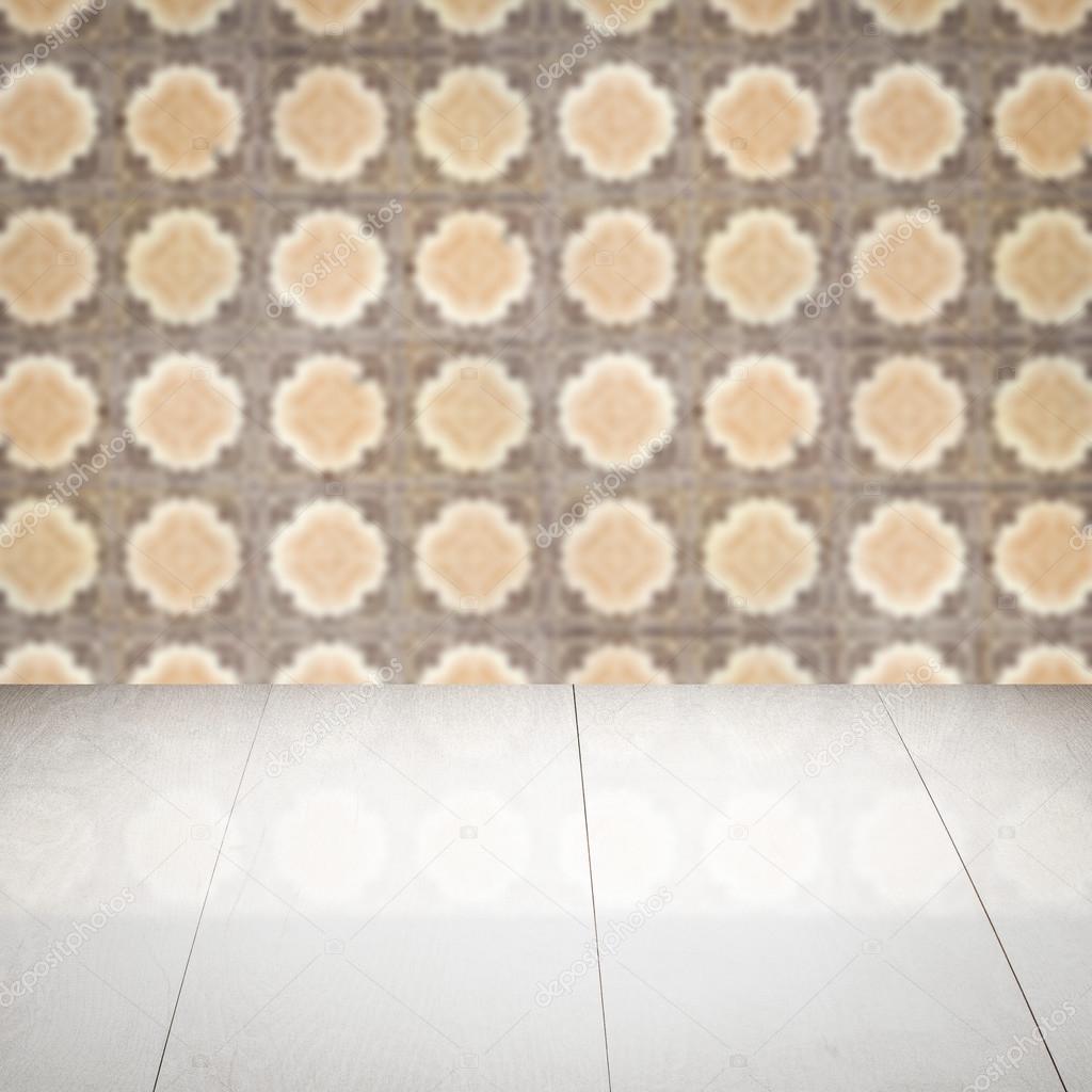 Wood table top and blur ceramic tile pattern wall — Stock Photo ...