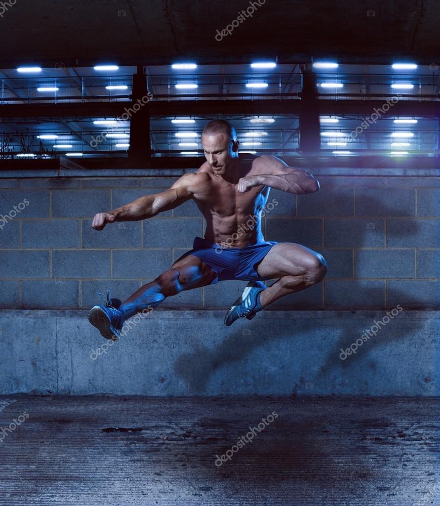 Athletic Man in Fighting Pose Inside a Building Stock Photo by ...