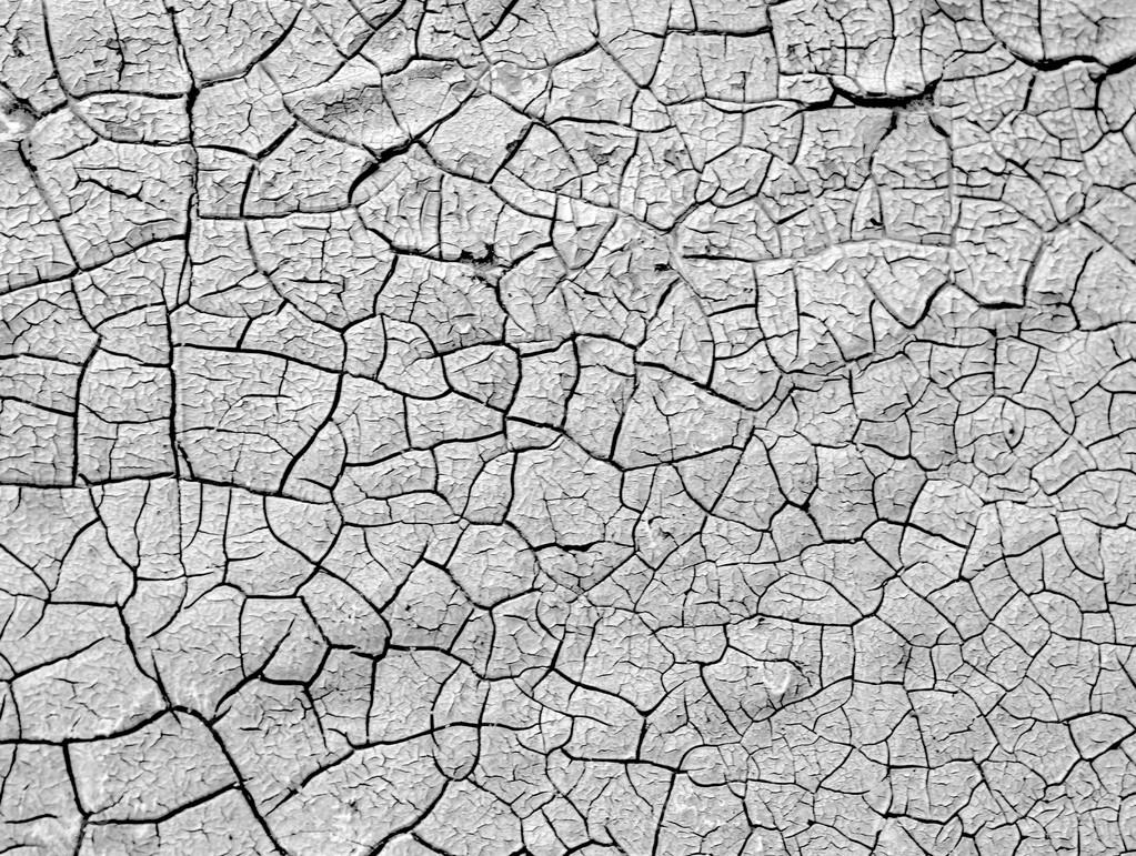 Gray background with cracks — Stock Photo © Verzhy #82504402