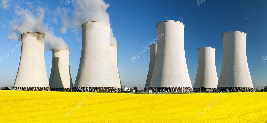 Nuclear power plant with field of rapeseed — Stock Photo © prudek #96334704