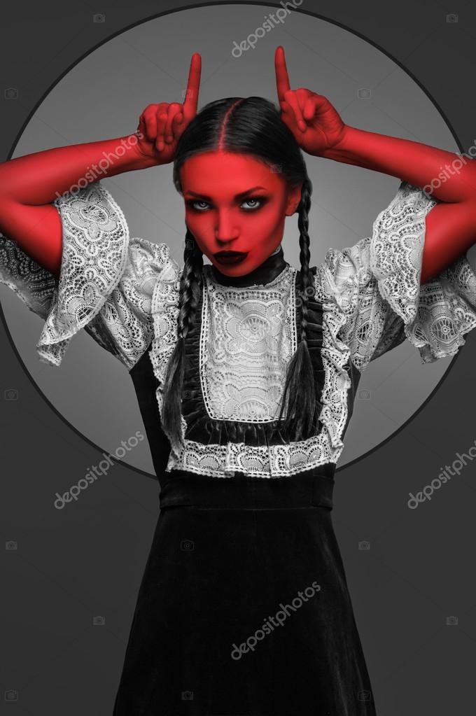 Beautiful devil woman Stock Photo by ©FlexDreams 120173072