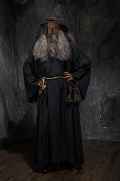 Old sorcerer with a wooden staff Stock Photo by ©FlexDreams 69616355