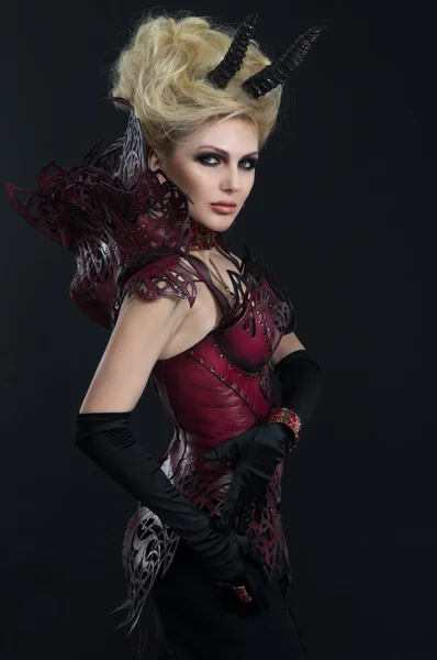 Beautiful devil woman Stock Photo by ©FlexDreams 82338954