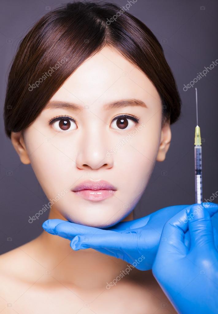 Asian beautiful woman gets injection in her face. aesthetic medi Stock ...