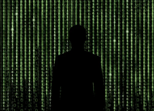 Silhouette of man looking through the matrix background - Stock Image ...