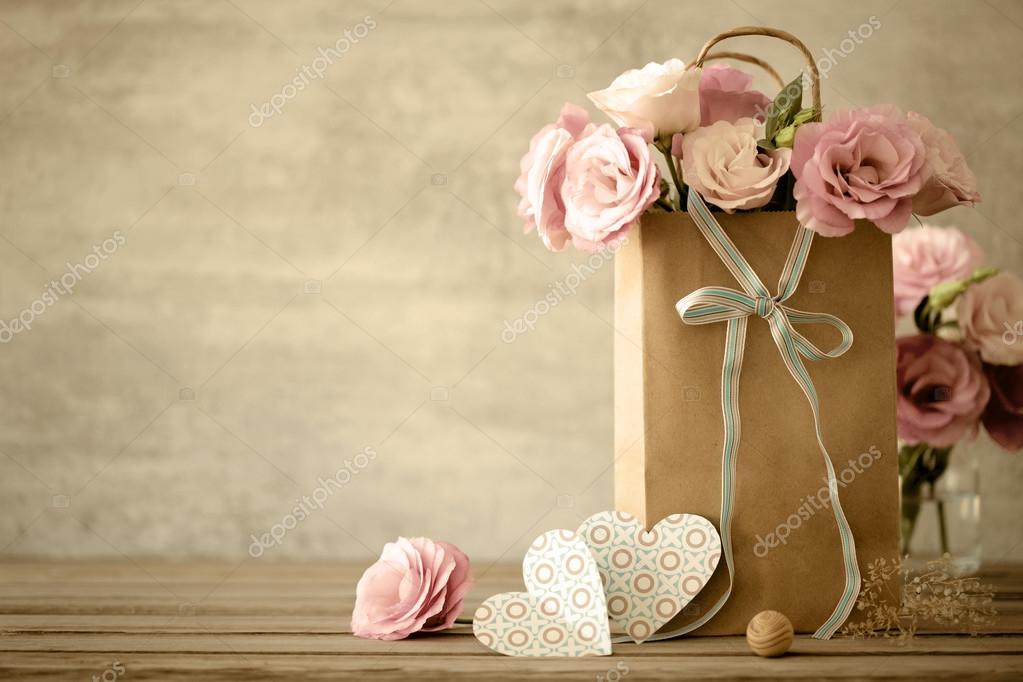 Love background with flowers and bow Stock Photo by ©a_taiga 84968396