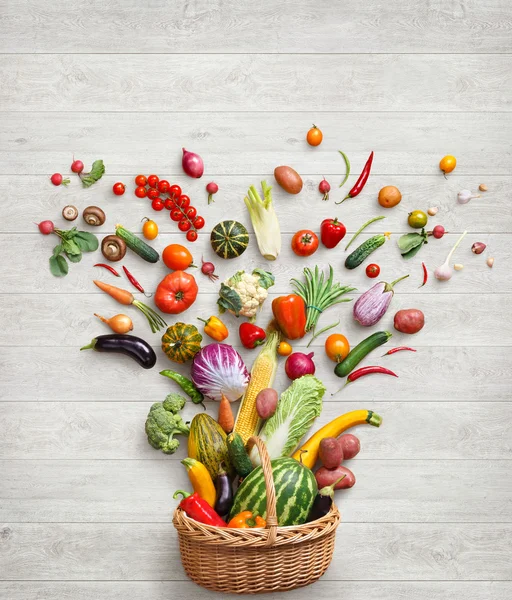 Studio photography of different vegetables on white wooden table ...