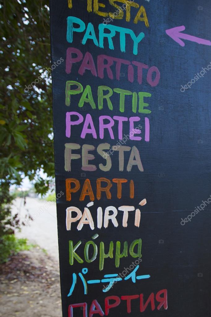 Party sign written in various languages and different colors Stock ...