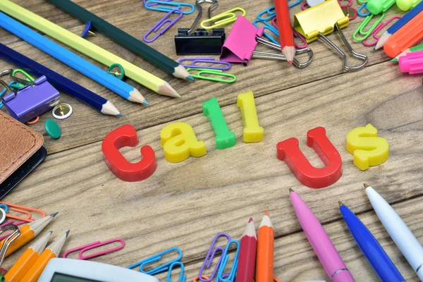 Call us word and office tools on wooden table - Stock Image - Everypixel