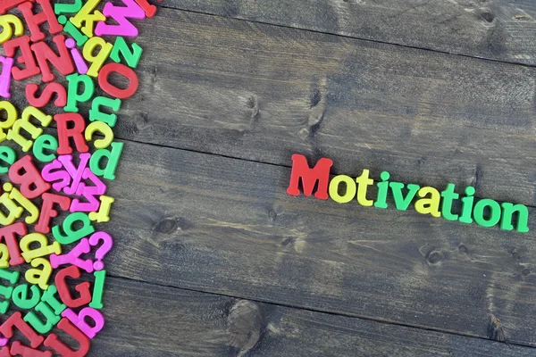 Motivation on wooden table - Stock Image - Everypixel