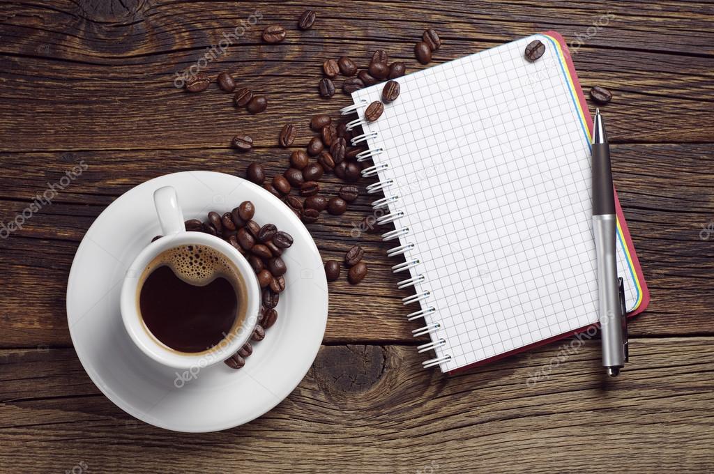 Opened notepad pen and coffee Stock Photo by ©Sasajo 71070603