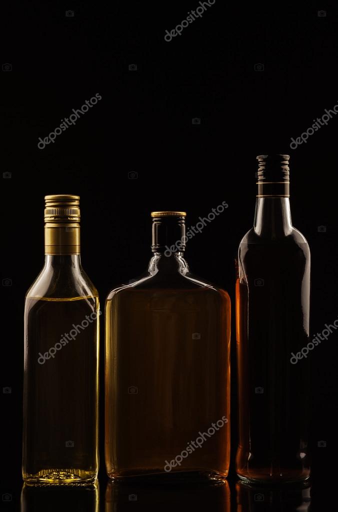 Alcohol drinks on black background without tags Stock Photo by ...
