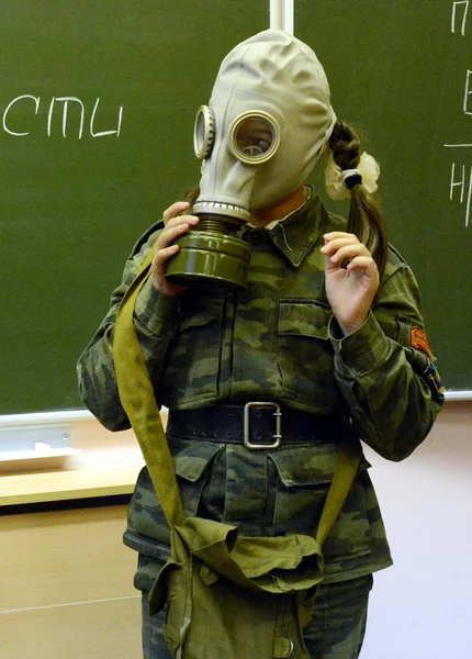 Training putting on the gas mask. - Stock Image - Everypixel
