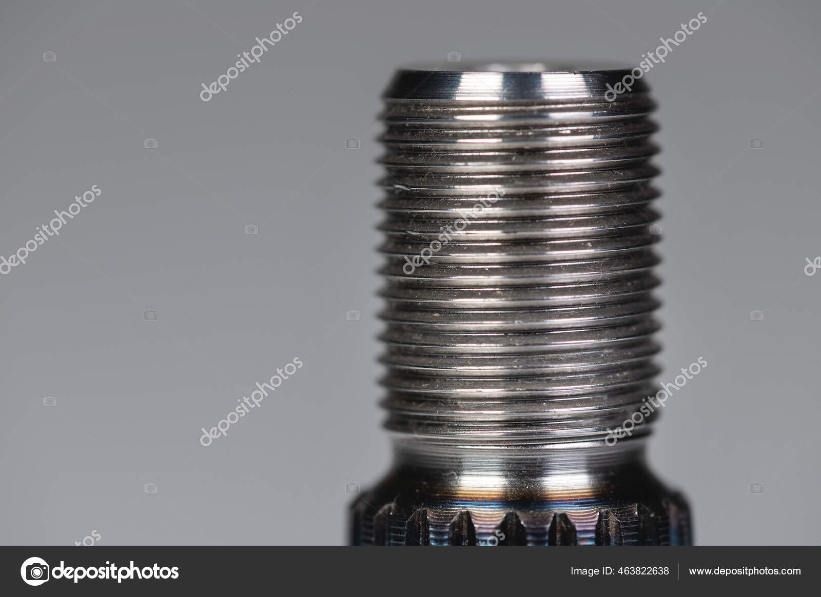Close-up thread and spline joint of the shaft of the CV joint on a gray ...
