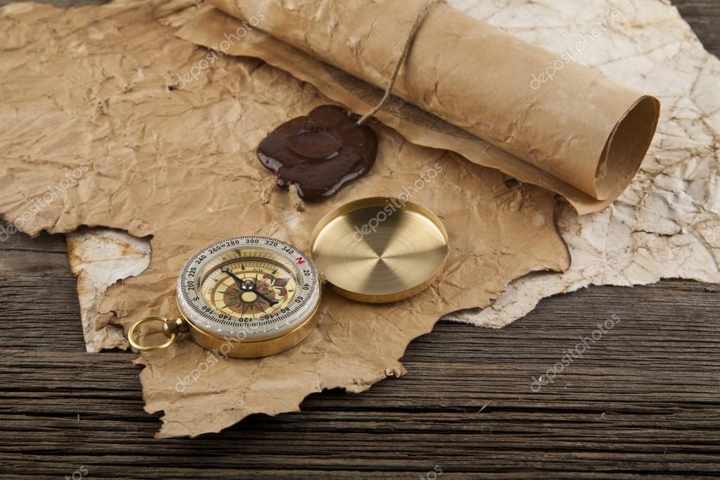 Old paper and compass Stock Photo by ©valzan 115729272