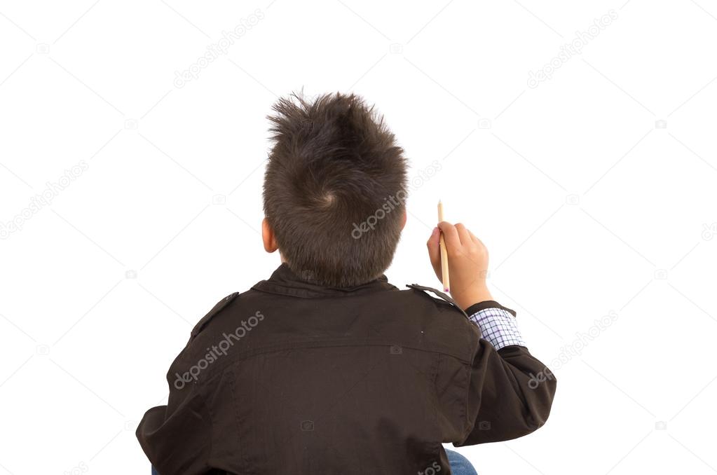 Little boy facing backwards, drawing in the air, isolated over white ...