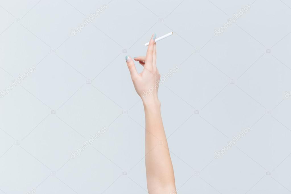 Female hand holding cigarette — Stock Photo © Vadymvdrobot #110659642