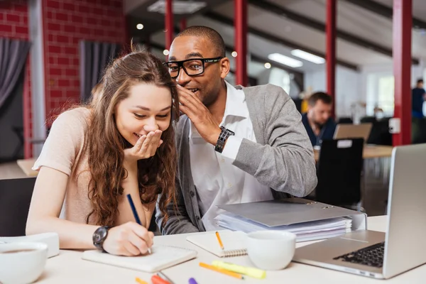 Happy young business people working together and laughing - Stock Image ...
