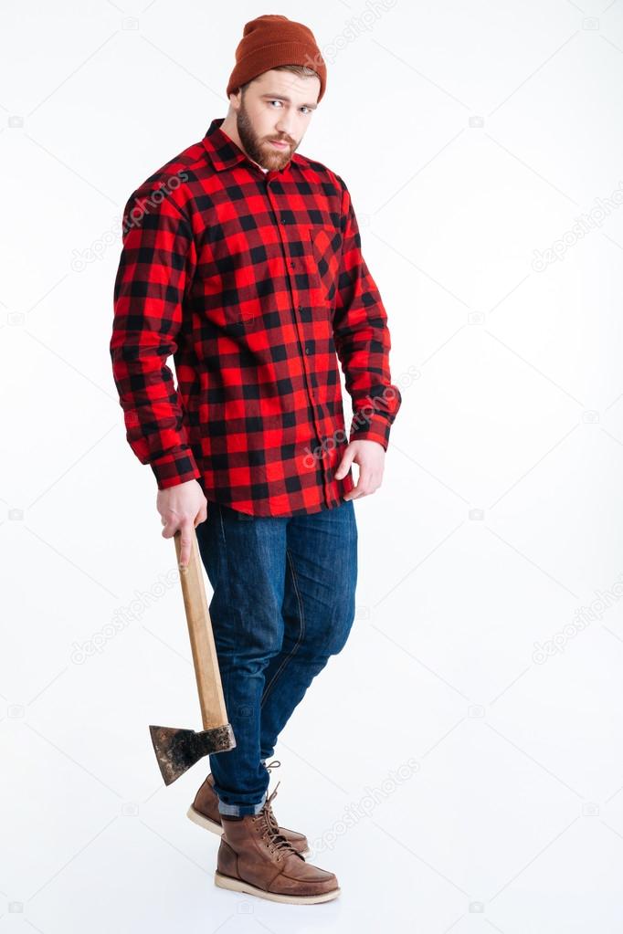 Young hipster guy holding axe and looking at camera Stock Photo by ...