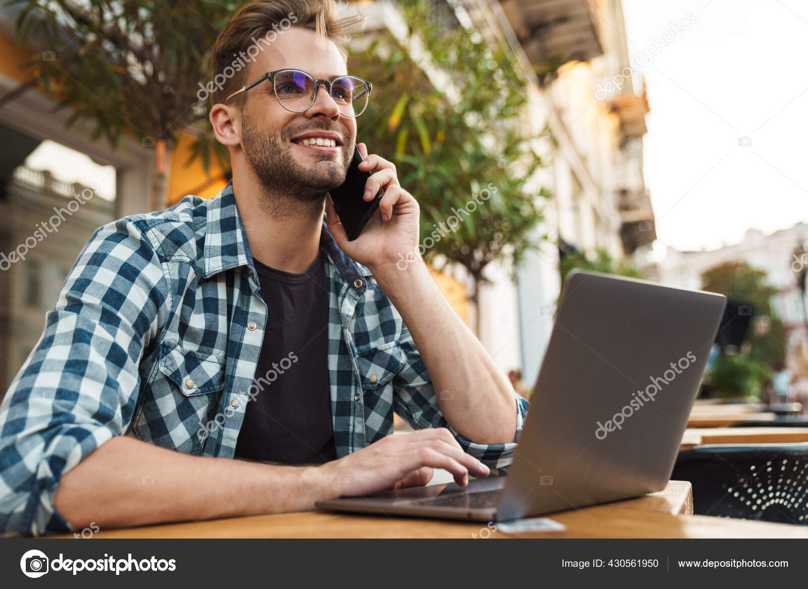 Smiling Young Man Working Laptop Computer While Sitting Sidewalk Cafe ...