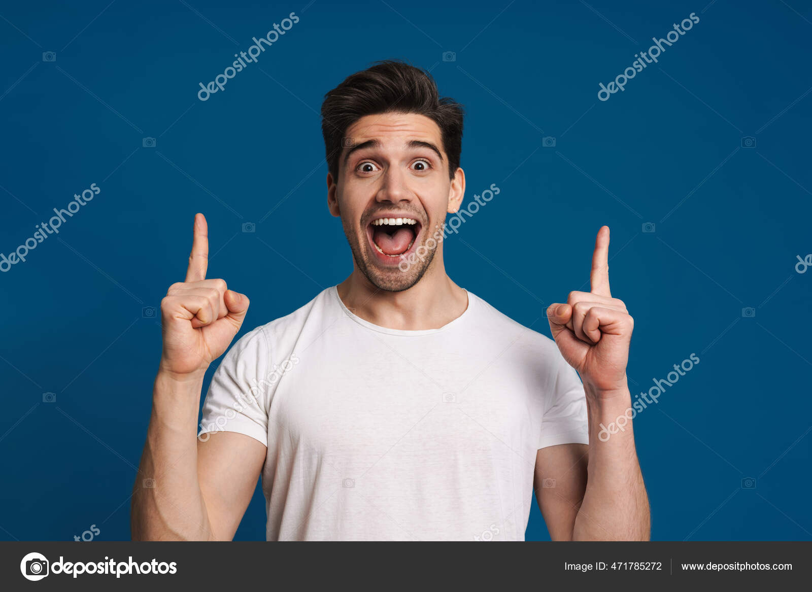 Excited Unshaven Guy Expressing Surprise Pointing Fingers Upward ...