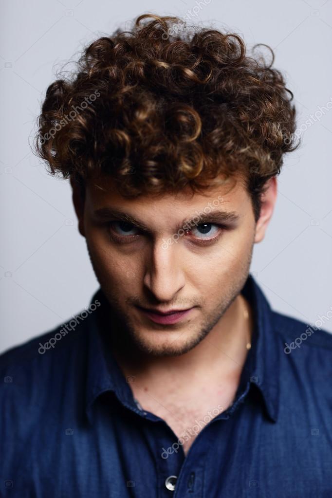 Handsome man with curly hair — Stock Photo © Vadymvdrobot #56139139