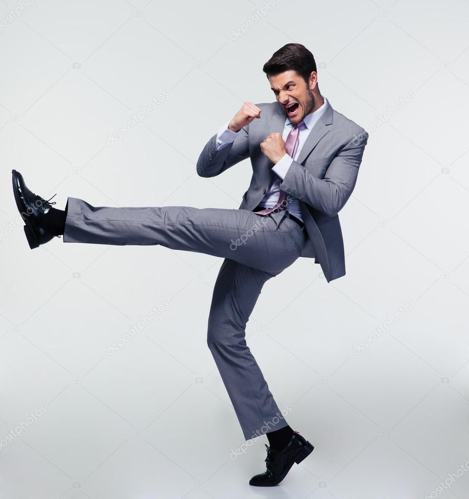 Handsome businessman kicking — Stock Photo © Vadymvdrobot #74752951