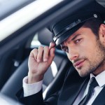 Male chauffeur sitting in a car Stock Photo by ©Vadymvdrobot 81903022