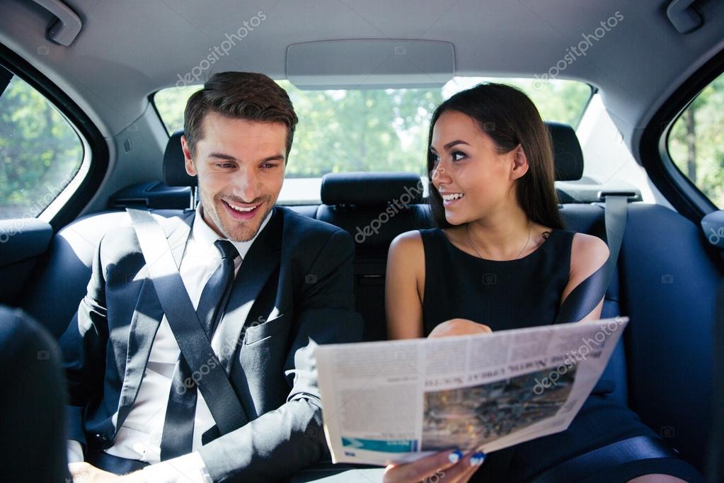 Couple reading newspaper in car — Stock Photo © Vadymvdrobot #81903248