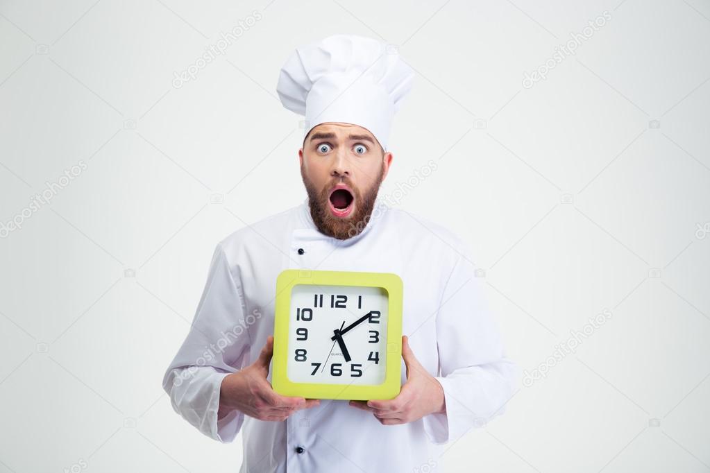 Shocked male chef cook holding wall clock — Stock Photo © Vadymvdrobot ...