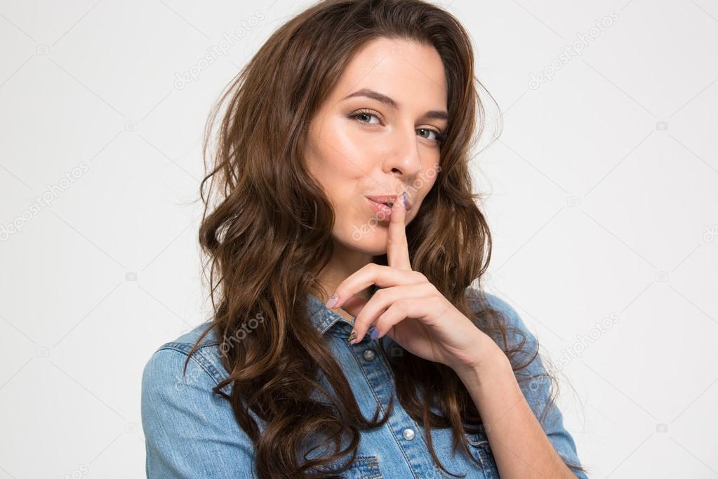 Woman showing finger over lips — Stock Photo © Vadymvdrobot #99787616