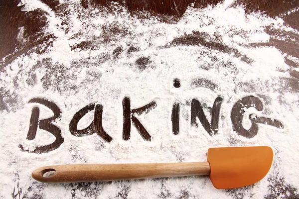 Word recipe written in white flour and spatula on wood — Stock Photo ...