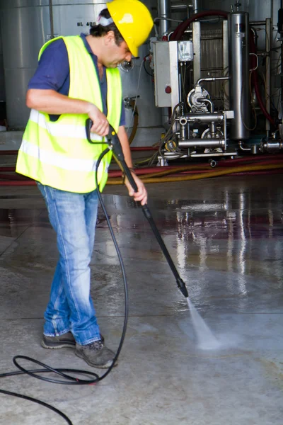 Worker in hard hat pressure washing Stock Photo by ©temis1964 59921813
