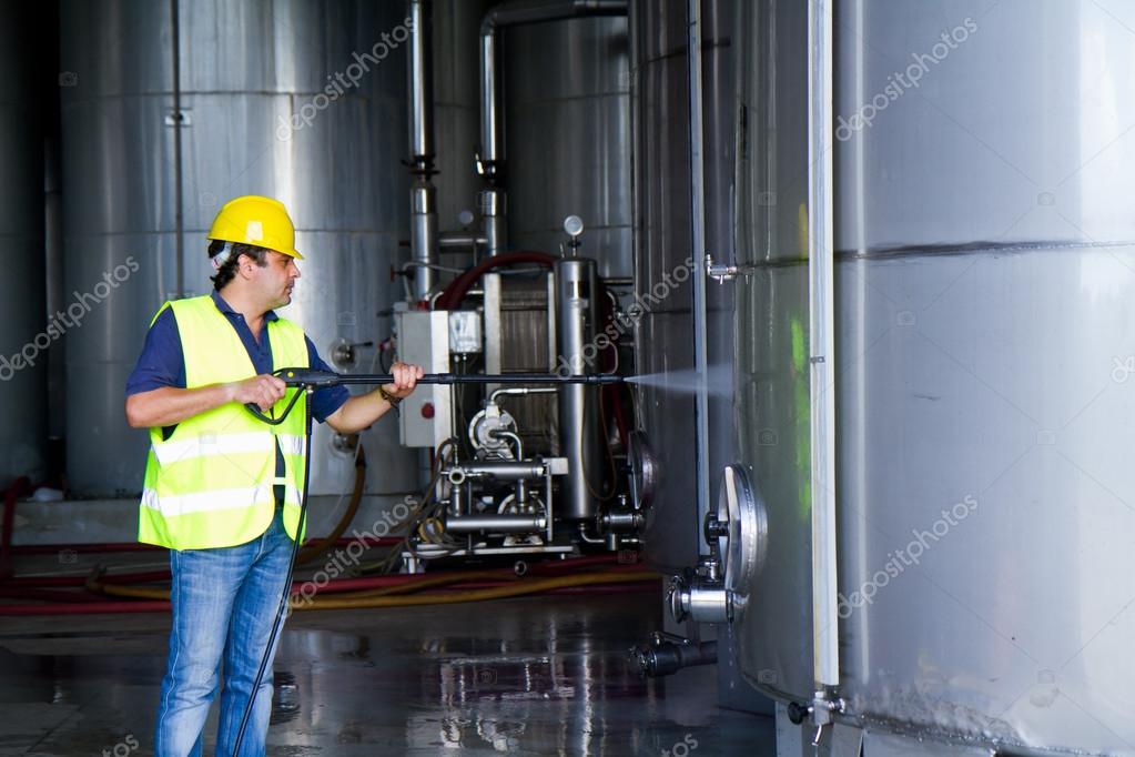 Worker in hard hat pressure washing — Stock Photo © temis1964 #59922775