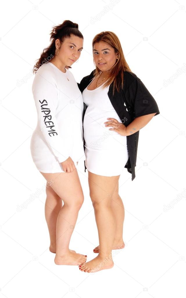 Two pretty girls standing bare feet. Stock Photo by ©sucher 79509020