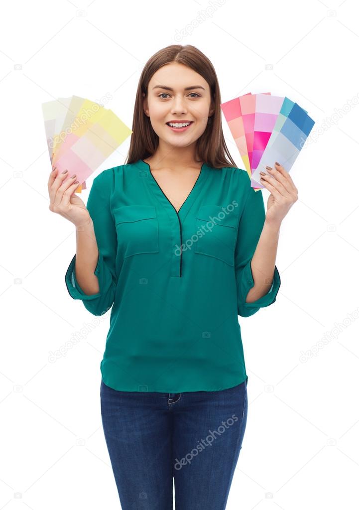 Smiling young woman with color swatches — Stock Photo © Syda ...
