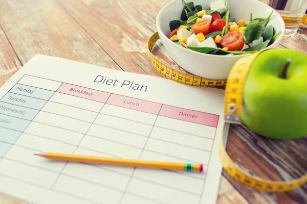 Close up of diet plan and food on table Stock Photo by ©Syda ...
