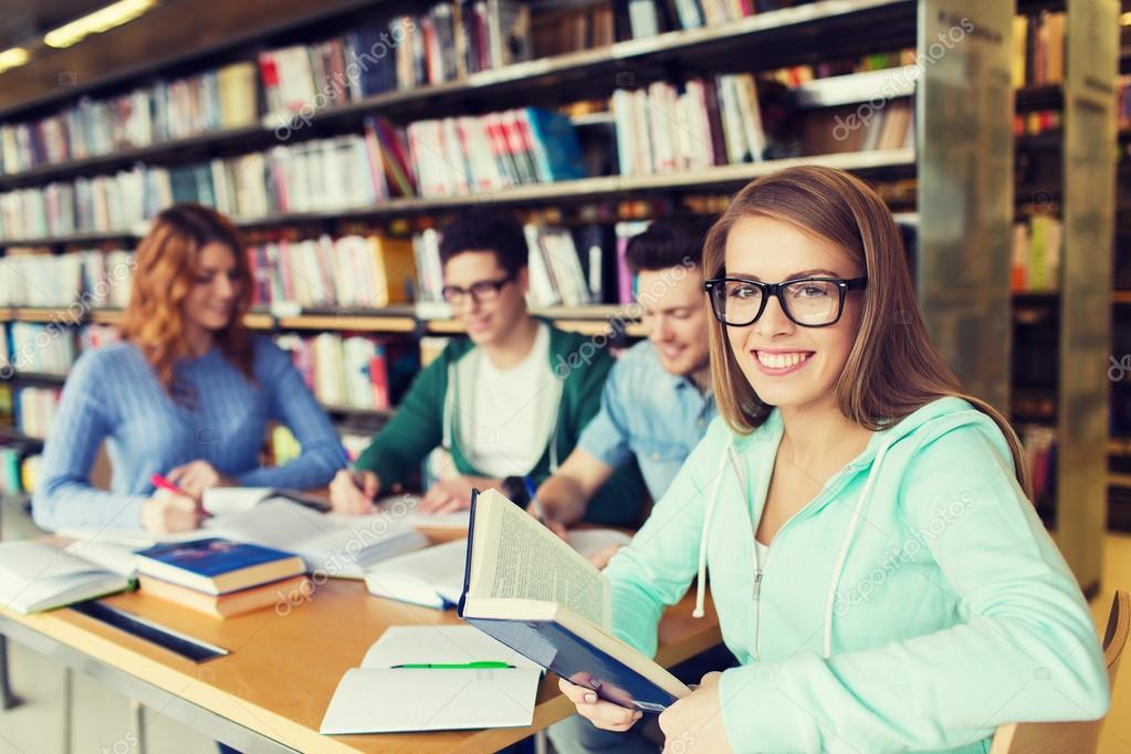Students Reading Books In Library