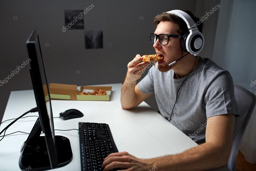 Man in headset playing computer video game at home — Stock Photo © Syda ...