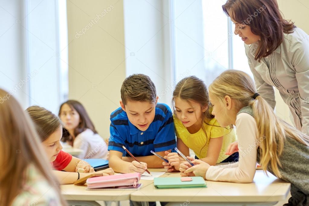 Group of school kids writing test in classroom — Stock Photo © Syda ...