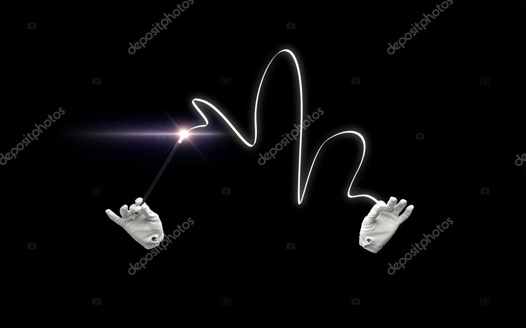 Magician hands with magic wand showing trick Stock Photo by ©Syda ...